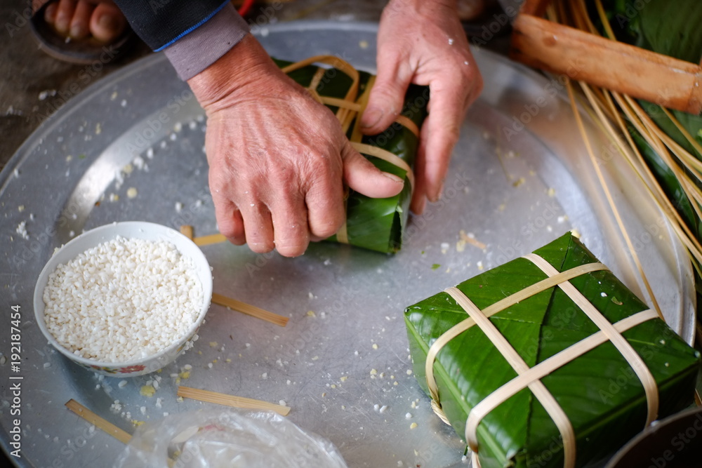 Photo & Art Print Packing Banh Chung (sticky rice cake), this is a ...