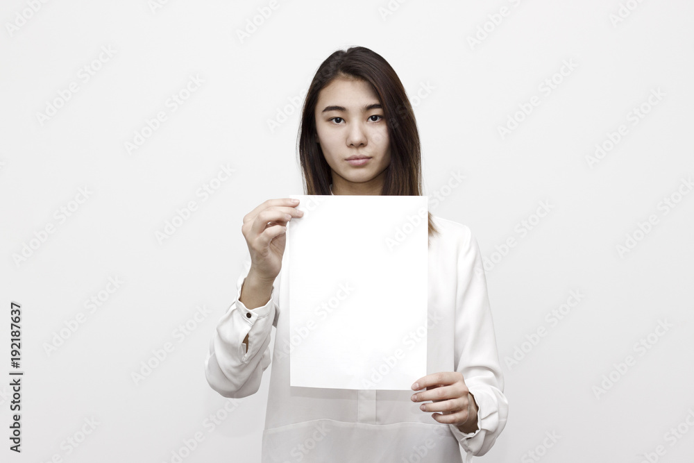 Astonished young girl holding two empty blank white board. Leaflet ...