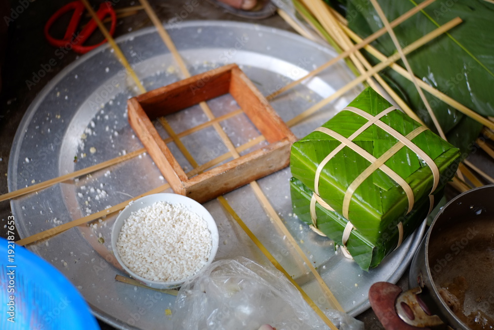 Packing Banh Chung (sticky rice cake), this is a traditional Vietnamese ...