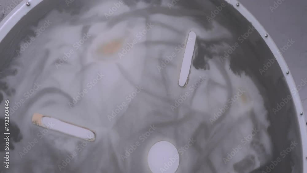 Interactive exposition in science museum - ironsand particles standing ...