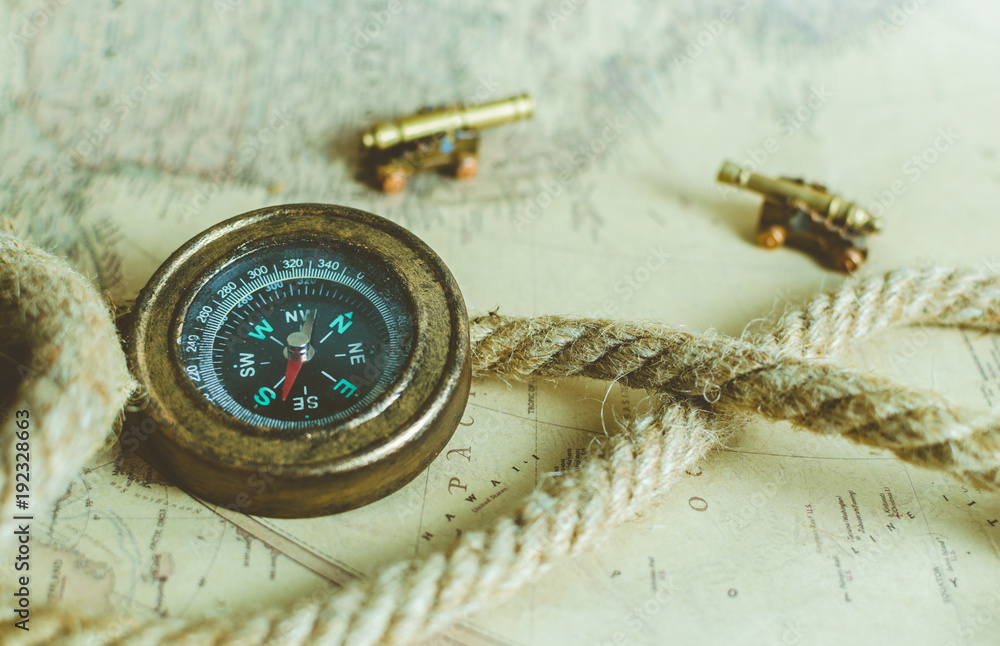 Old compass and two ship cannons on the old map Stock Photo | Adobe Stock