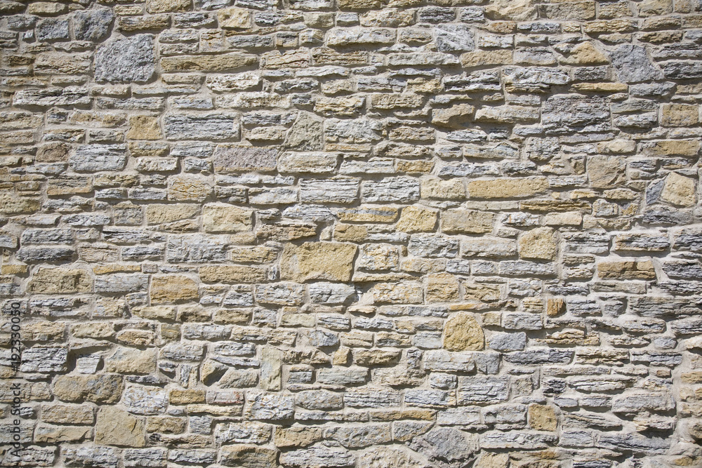 Old stone wall made of limestone and sandstone Stock Photo | Adobe Stock