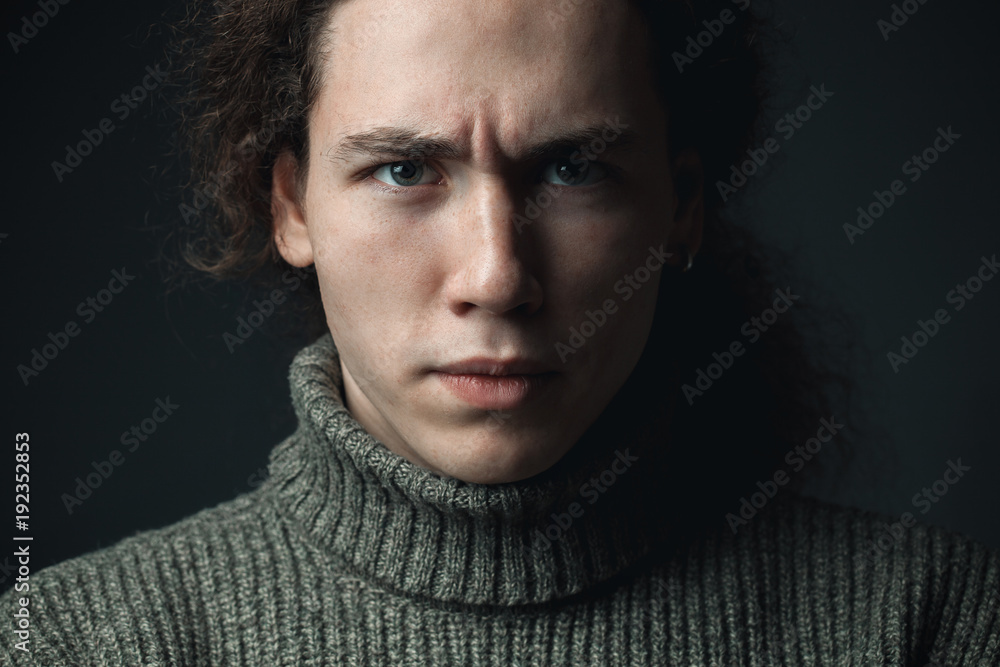 stern look. studio portrait. low key Stock Photo | Adobe Stock