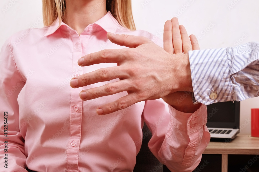 Zdjęcie Stock: Boss man shows inappropriate behavior towards young ...