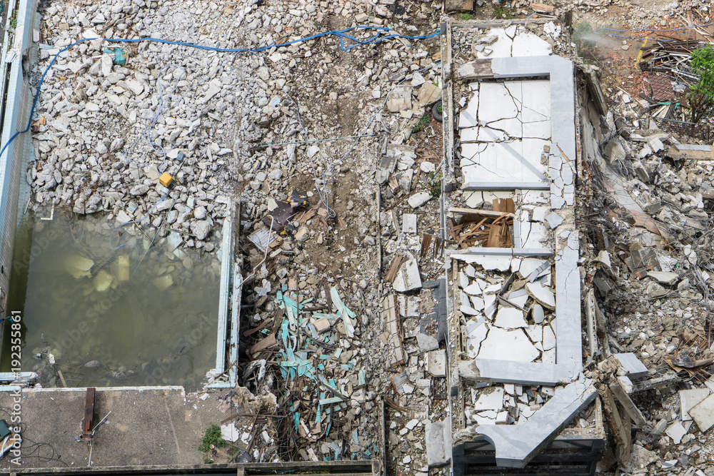 Top view of damage area, crash and collapse building with excavator to ...
