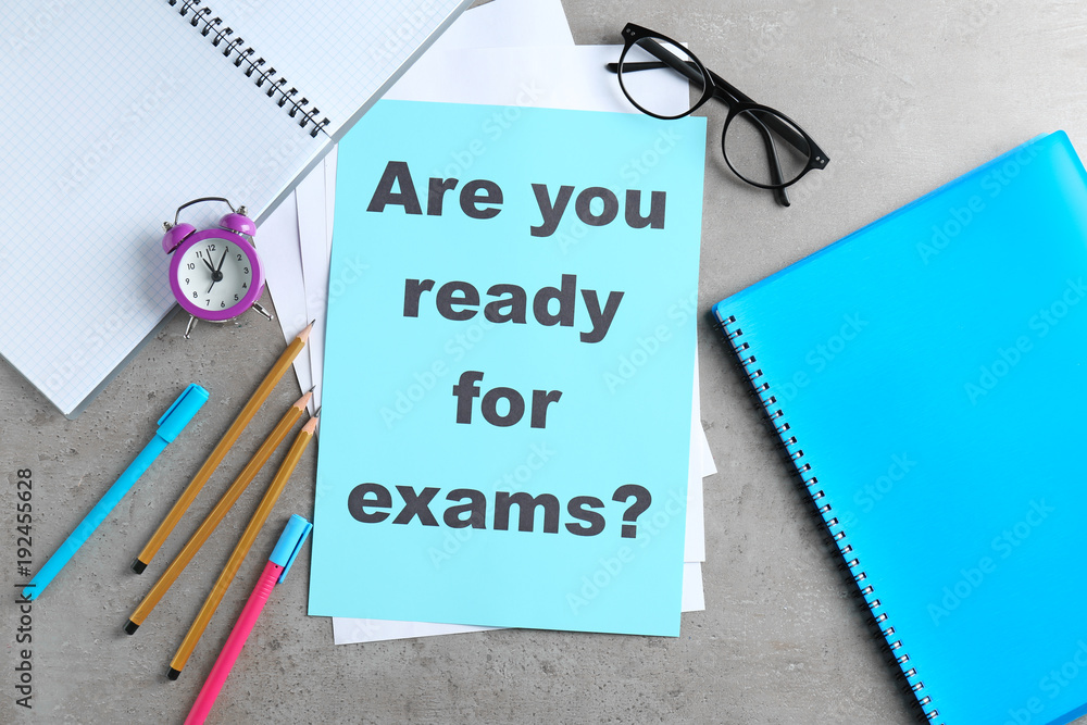 Paper with question "Are you ready for exams?" and stationery on table ...