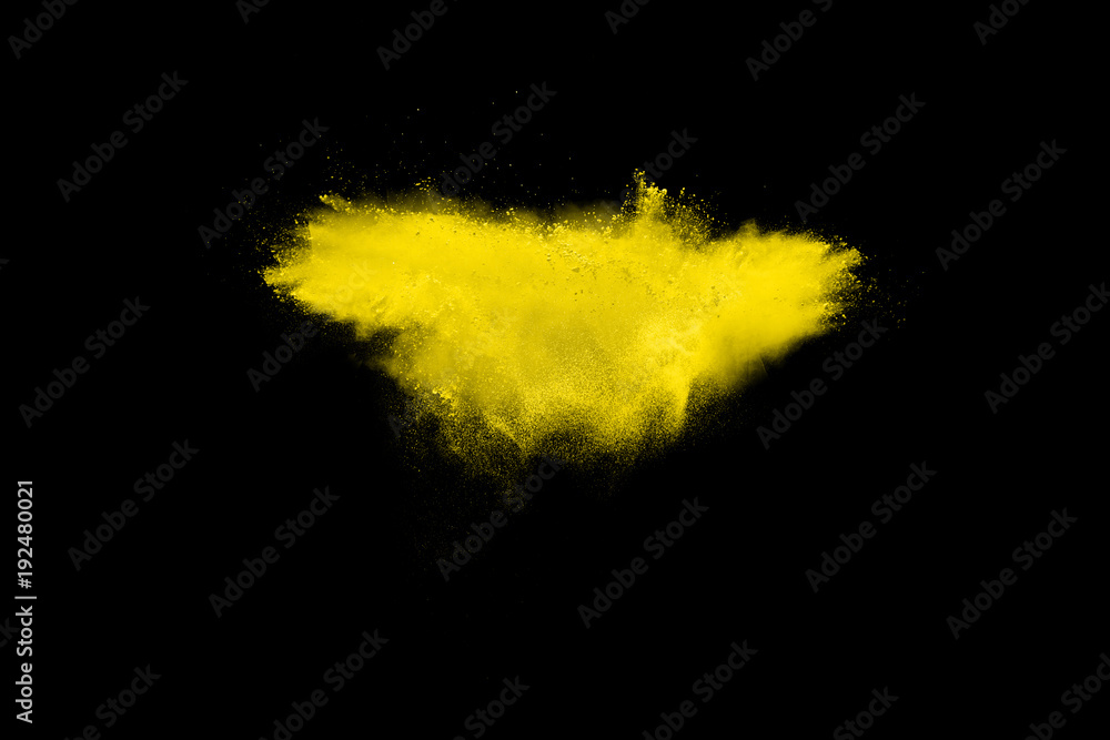Abstract multicolored powder splatter on black background,Freeze motion ...