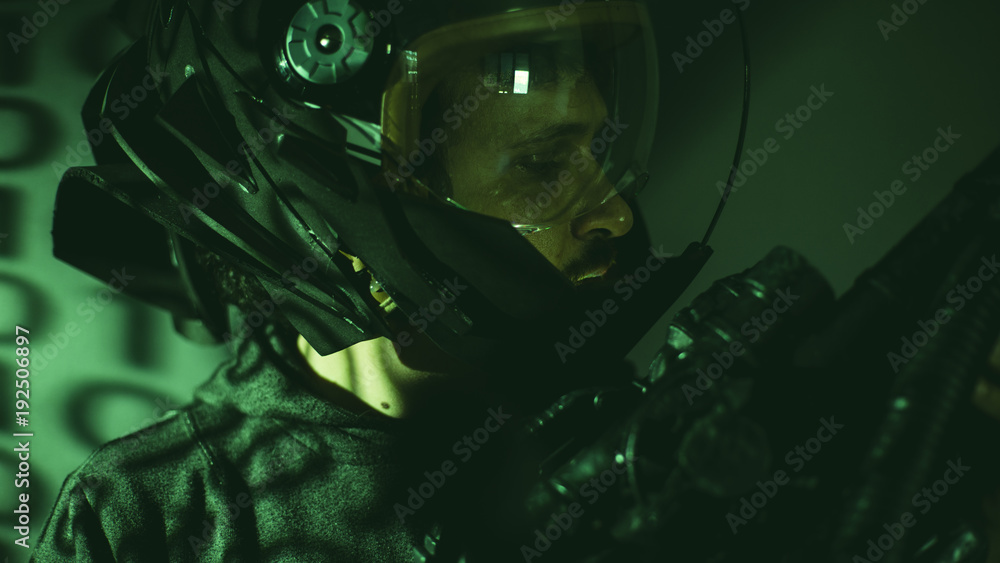 Soldier, cyborg man of the future with helmet lights led and huge laser ...