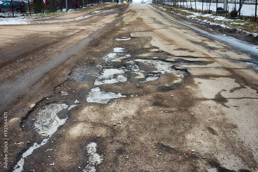 Old road. Concept highway in huge pits and potholes cloudy weather, sky ...