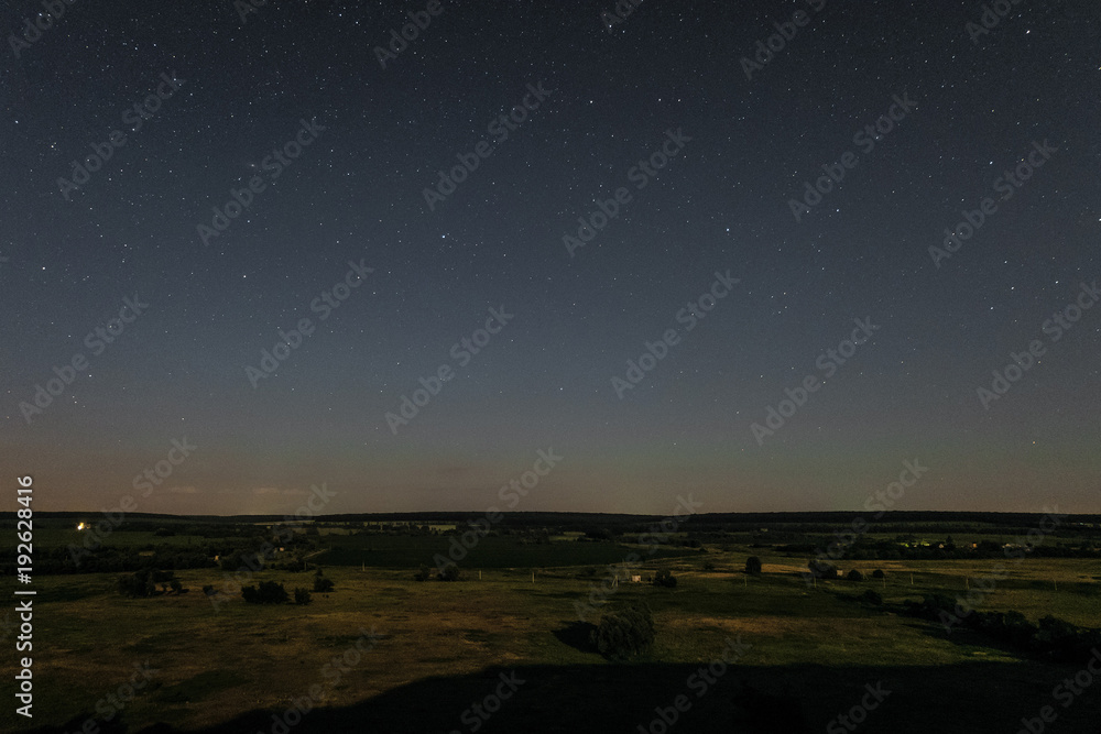 View of green forest-steppe plain at night. Landscape from height with ...