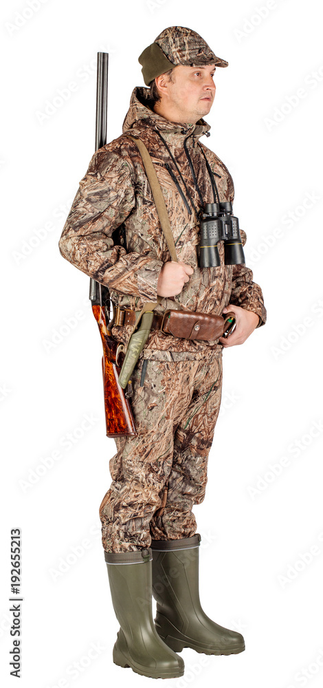 Full length portrait of a male hunter with double barreled shotgun ...