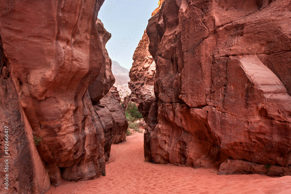 Red stone walls of the canyon of Wadi Rum desert in Jordan. Wadi Rum ...