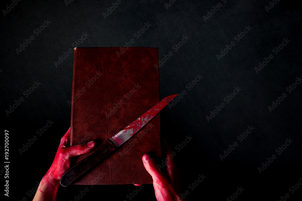 Alchemy book with bloody hand Stock Photo | Adobe Stock