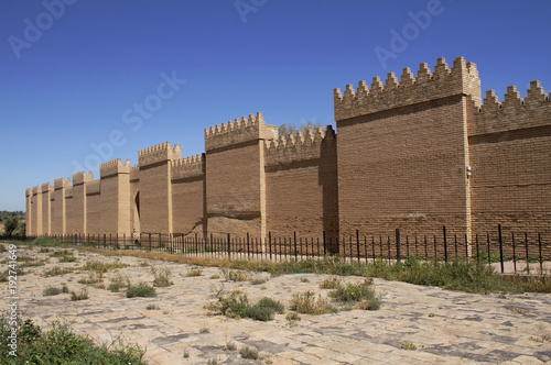 Restored ruins of ancient Babylon, Iraq. In front of the wall is ...