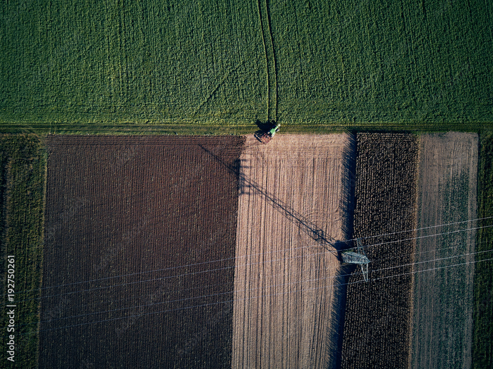 Fotka „Drone flight aerial bird eye view of tractor mowing grass on ...