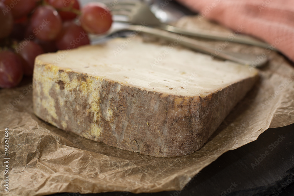 Tasting of ancient french demi soft cheese Tomme from French Alps, made ...