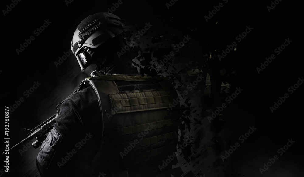 Black and white swat soldier back view posing with dissolving effect on ...