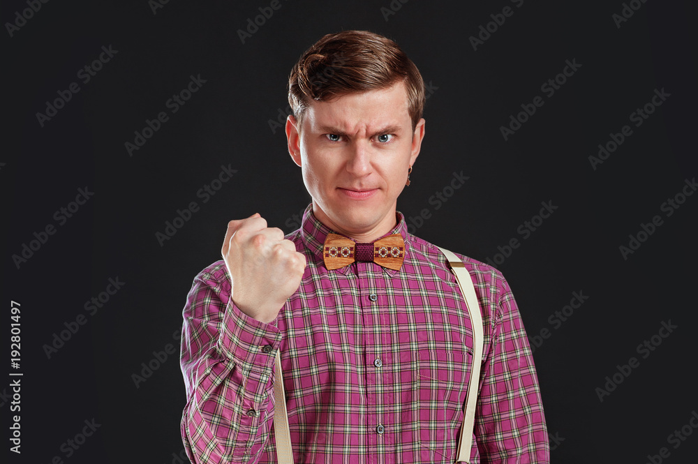 Feeling so angry! Angry young man in vintage shirt and bow tie with ...