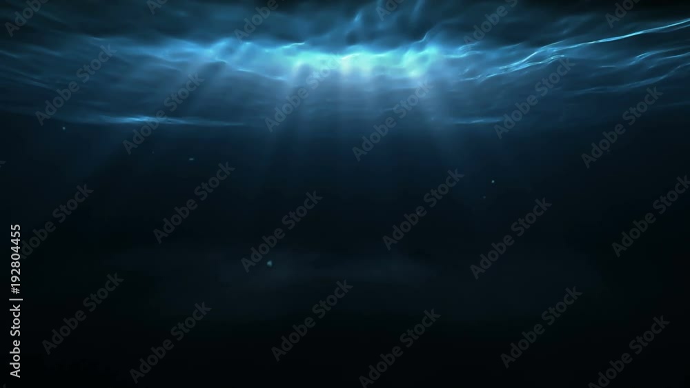 Underwater with floating plankton and sunray through water surface ...