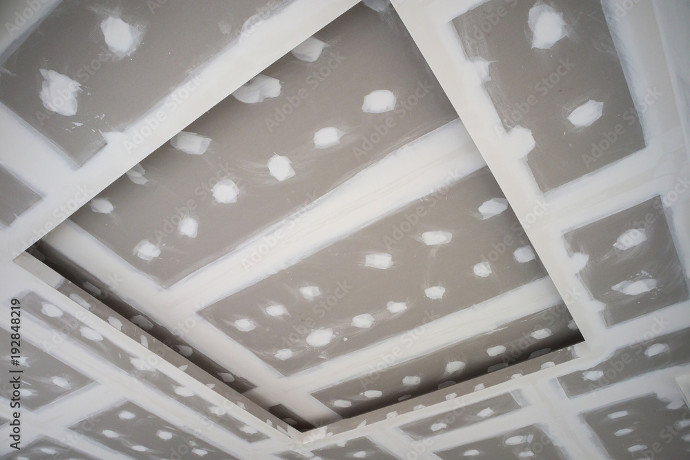 ceiling gypsum board installation at construction site Stock Photo ...