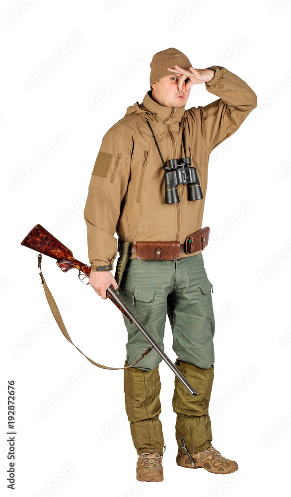 Full length portrait of a male hunter with double barreled shotgun ...