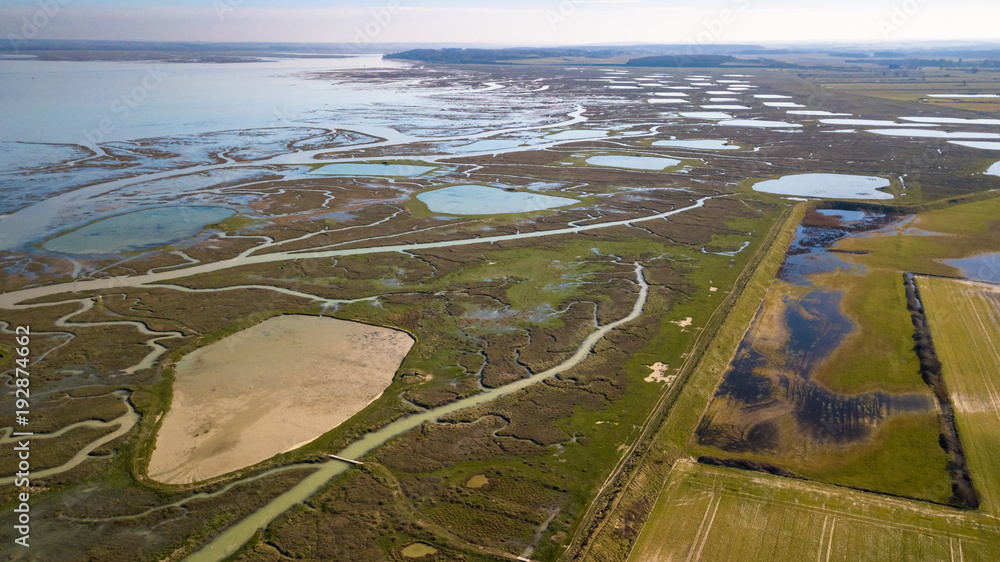 Drone view of a spectacular delta where a river flows into the sea ...