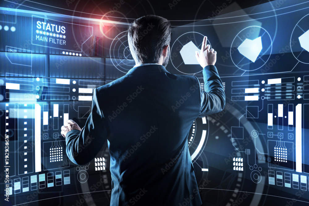 New location. Calm clever responsible programmer touching the ...