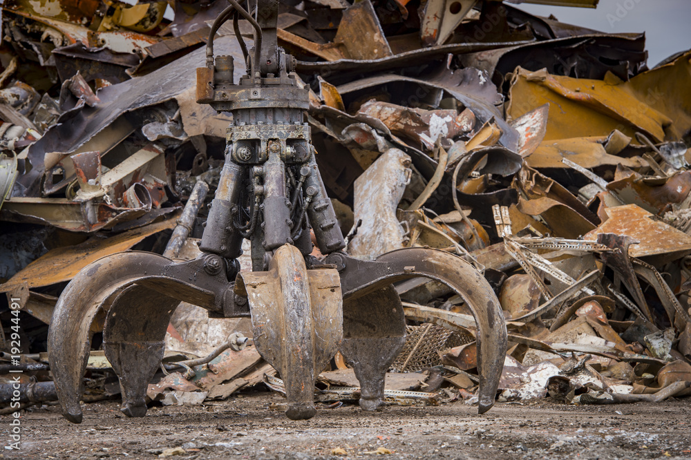 Scrap recycling plant, Crane grabber, pile metal to recycle Stock Photo ...