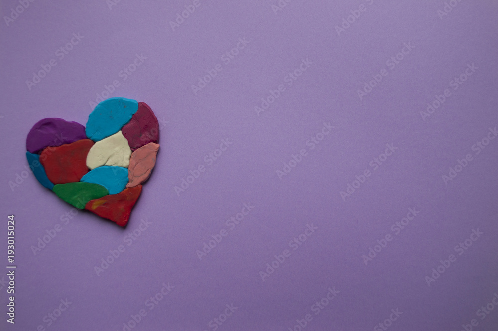 Colorful heart on violet background with text space. Symbol of world ...