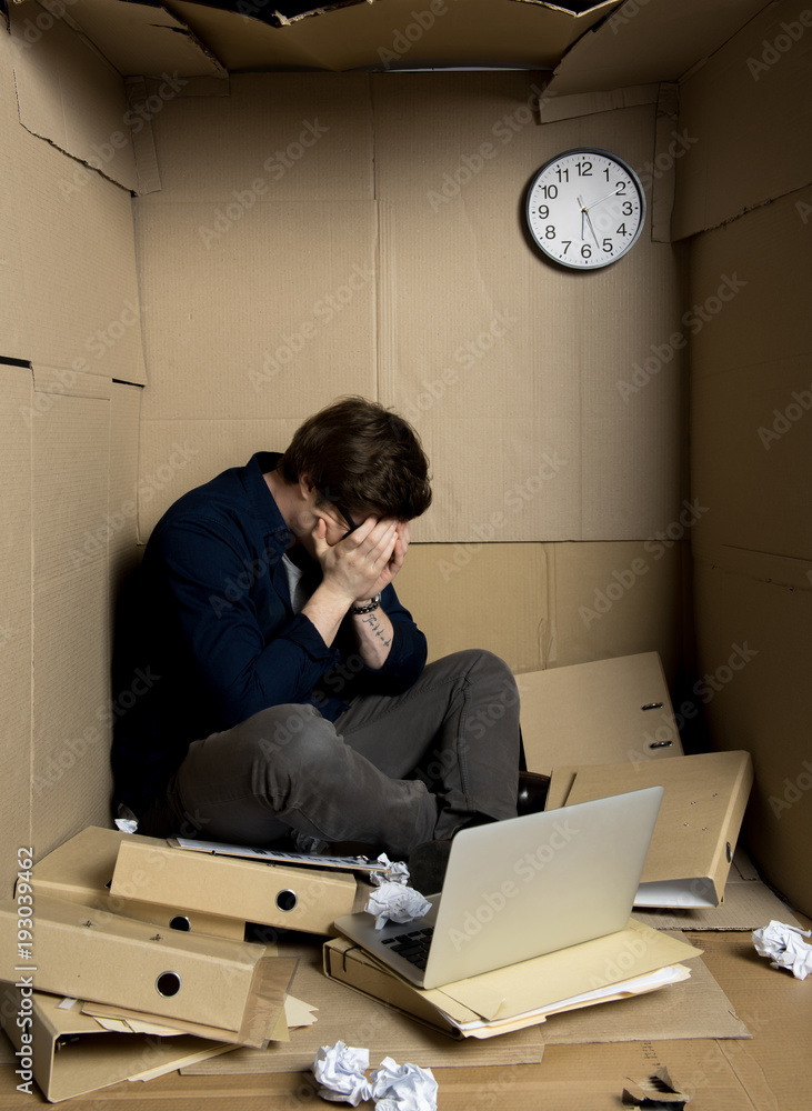 Deep depression concept. Full length of tearful employee is sitting ...