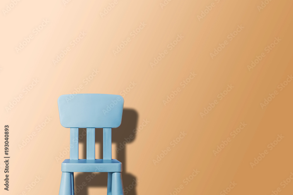 Blue pastel chair on a pastel background. Pastel colors. Bright orange ...
