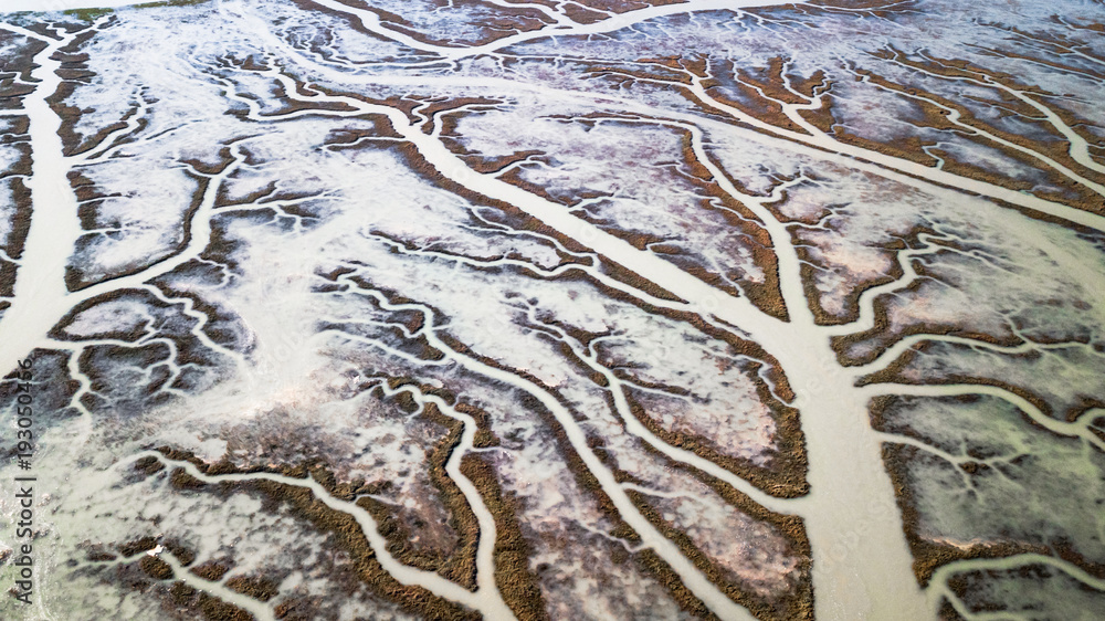 Drone view of a spectacular delta where a river flows into the sea ...