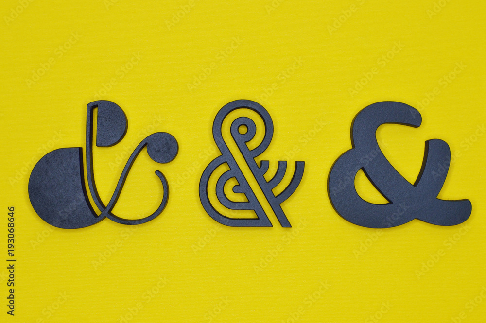 Poster three black ampersand characters on yellow background – Wall Art ...