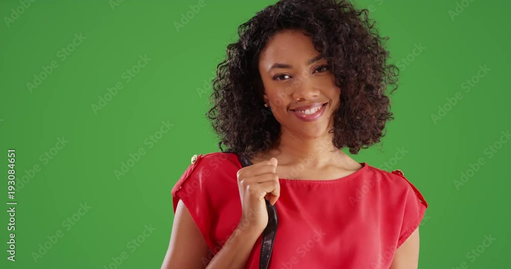 Green screen close up of smiling black woman in red top looking at ...