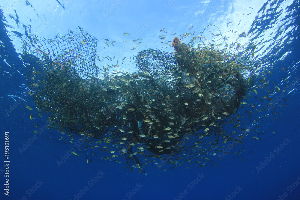 Ghost net. Abandoned fishing net pollution of ocean environment Stock ...