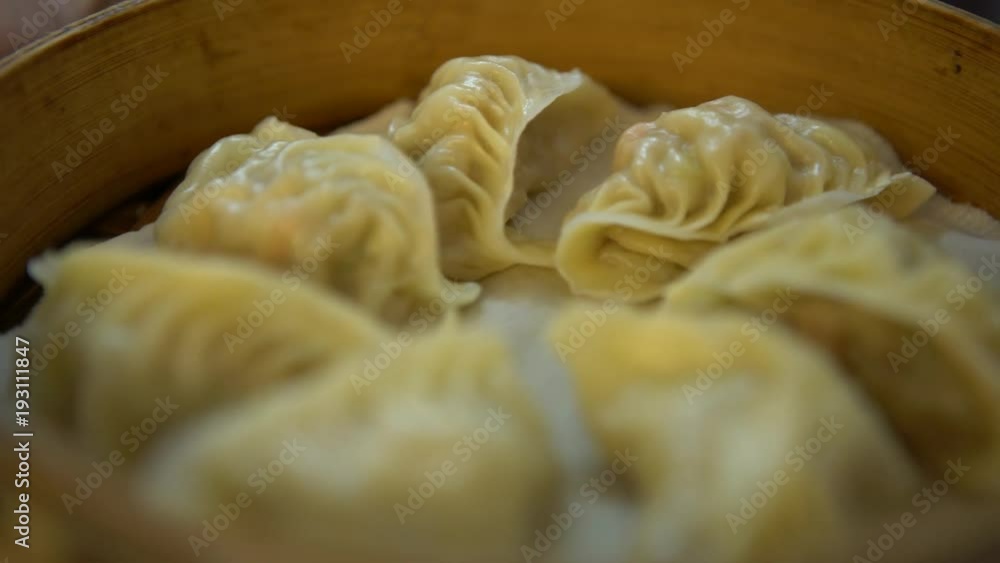 4K Dish of dumpling in a restaurant. Traditional chinese food served in ...