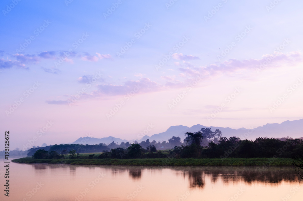 Beautiful tranquil river scene in evening or morning with warm sunset ...