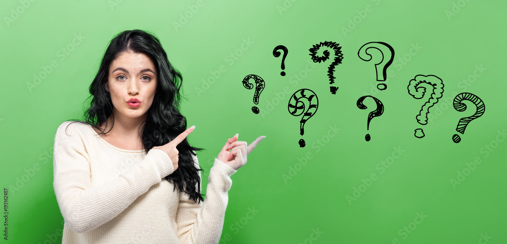 Question Marks with young woman on a green background Stock Photo ...