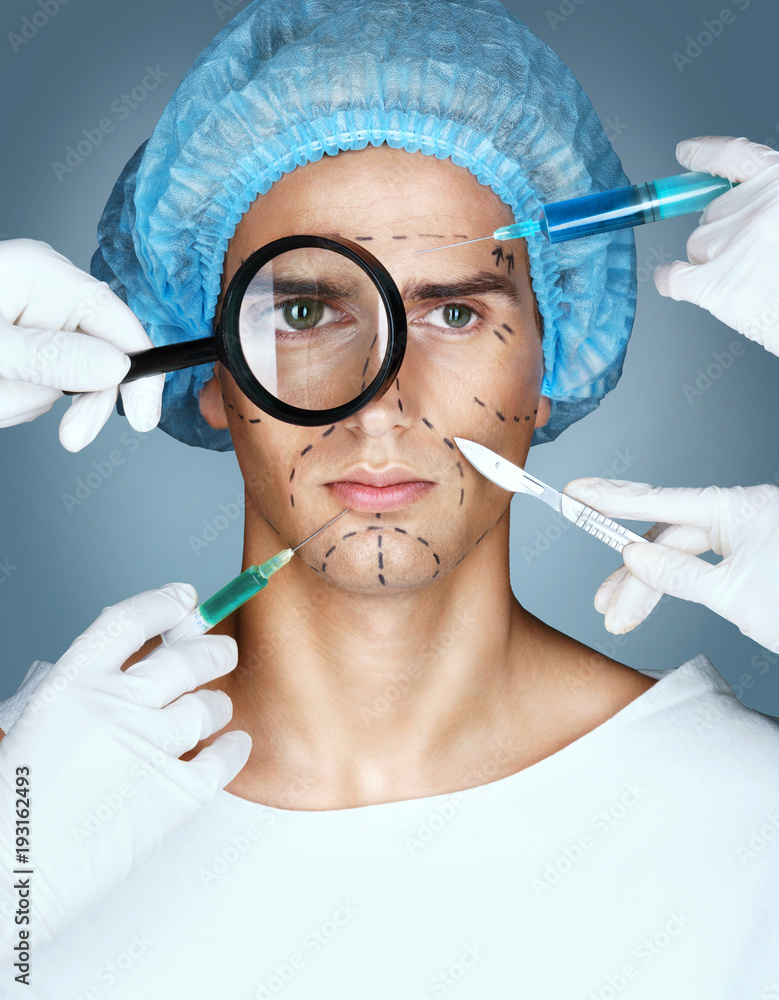 Man's face and many hands with syringes and scalpels near his face ...
