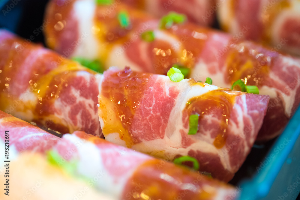 Raw kurobuta pork slices on plates, for sukoyaki and yakiniku hot pot ...