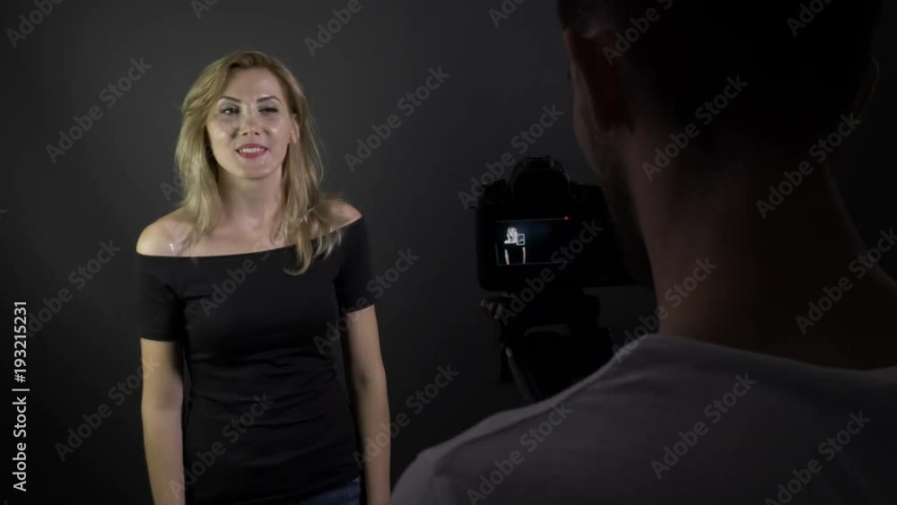 Brother filming his vlogger sister in a home studio for a new episode ...