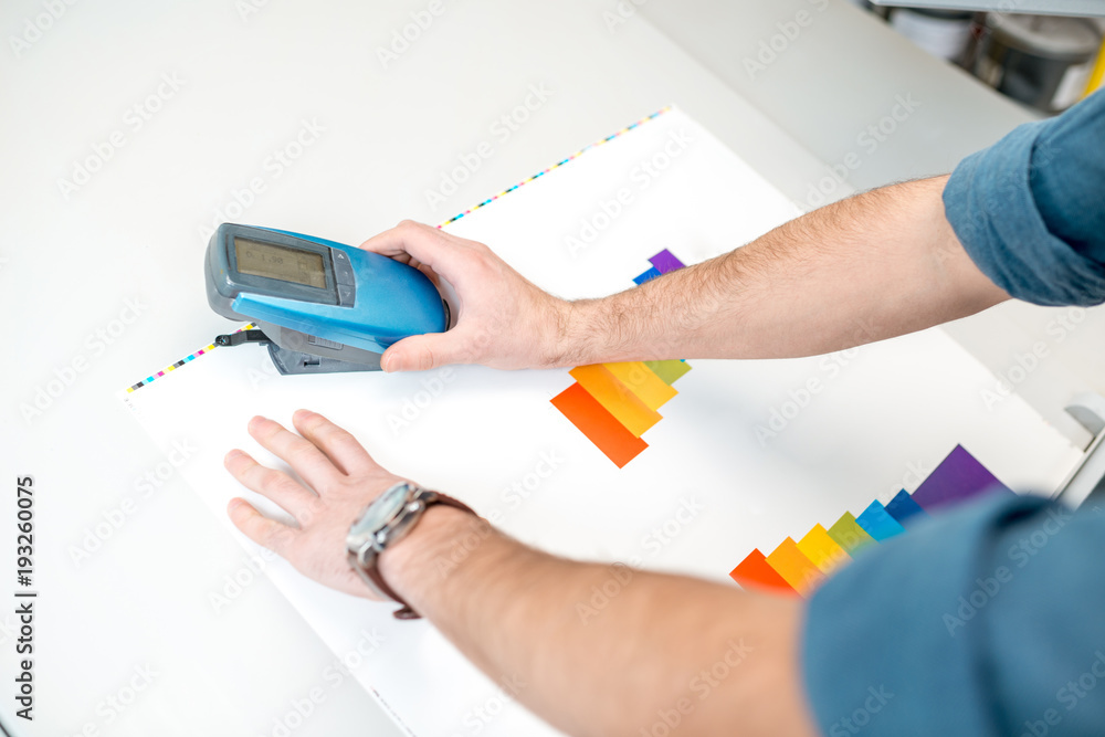 Measuring color on the paper print with spectrometer tool at the ...