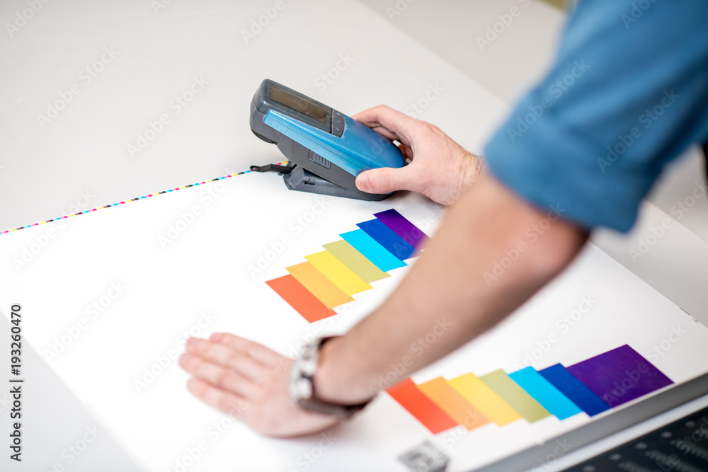 Measuring color on the paper print with spectrometer tool at the ...