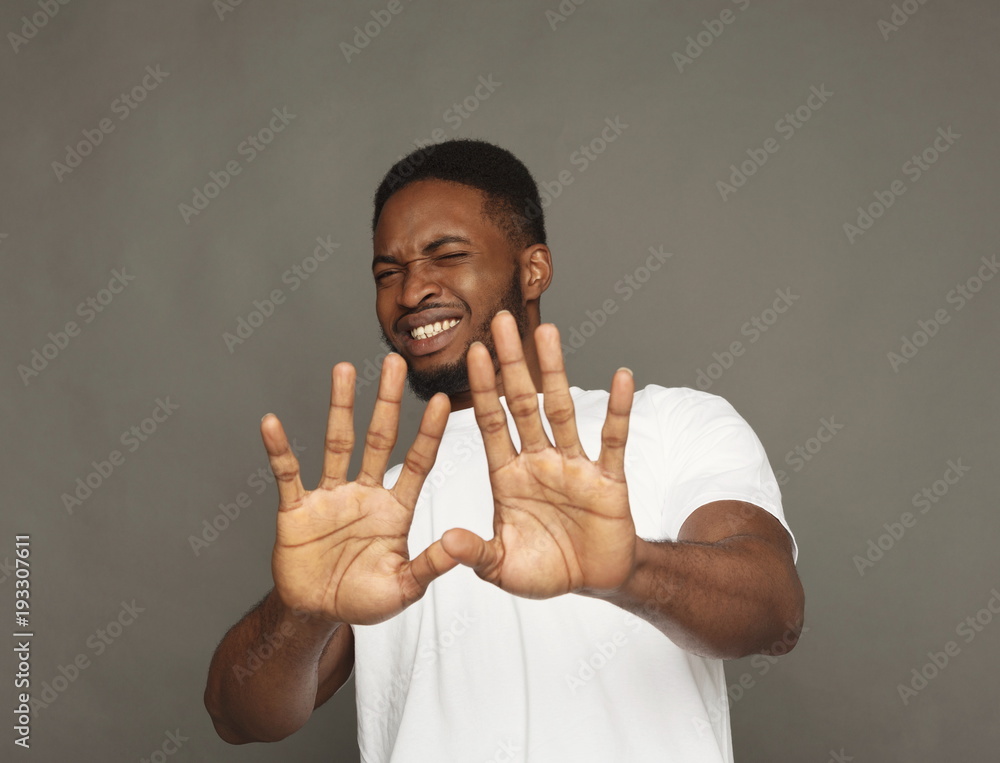 Negative human emotion, black man expressing disgust Stock Photo ...
