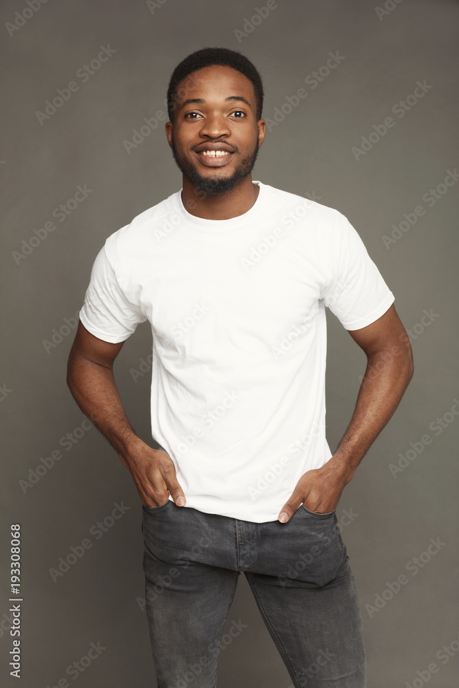 Happy young black man portrait at studio background. Stock Photo ...