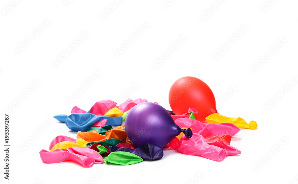 Pile of deflated and inflated colorful balloons, isolated on white ...