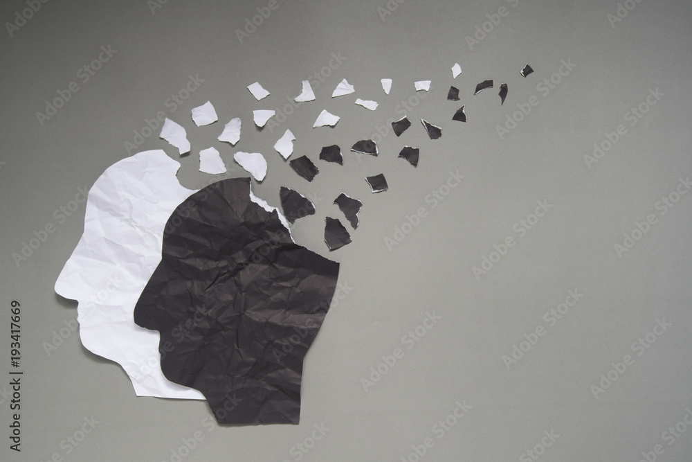 Bipolar disorder presented by human head made from black&white crumpled ...