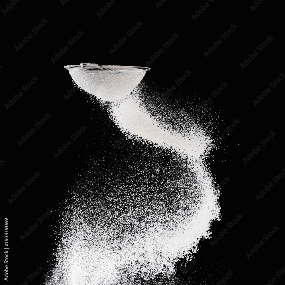sieve with falling flour isolated on black Stock Photo | Adobe Stock
