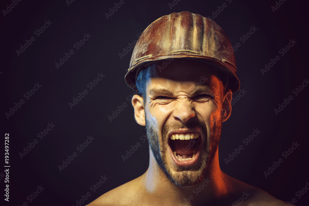 Portrait of screaming bearded handsome builder, closeup. Bearded man ...
