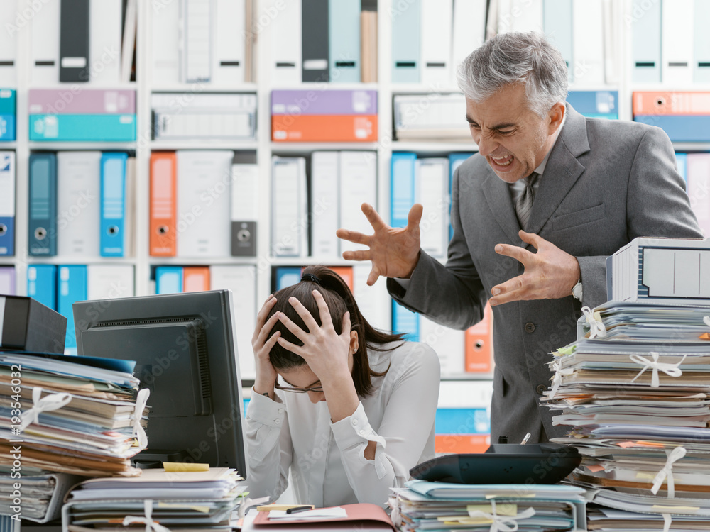 Angry boss yelling at his young employee Stock Photo | Adobe Stock